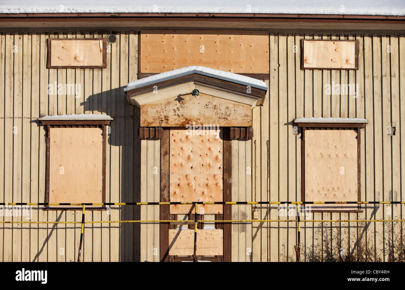 Windows and door covered with plywood sheets , Finland Stock Photo - Alamy
