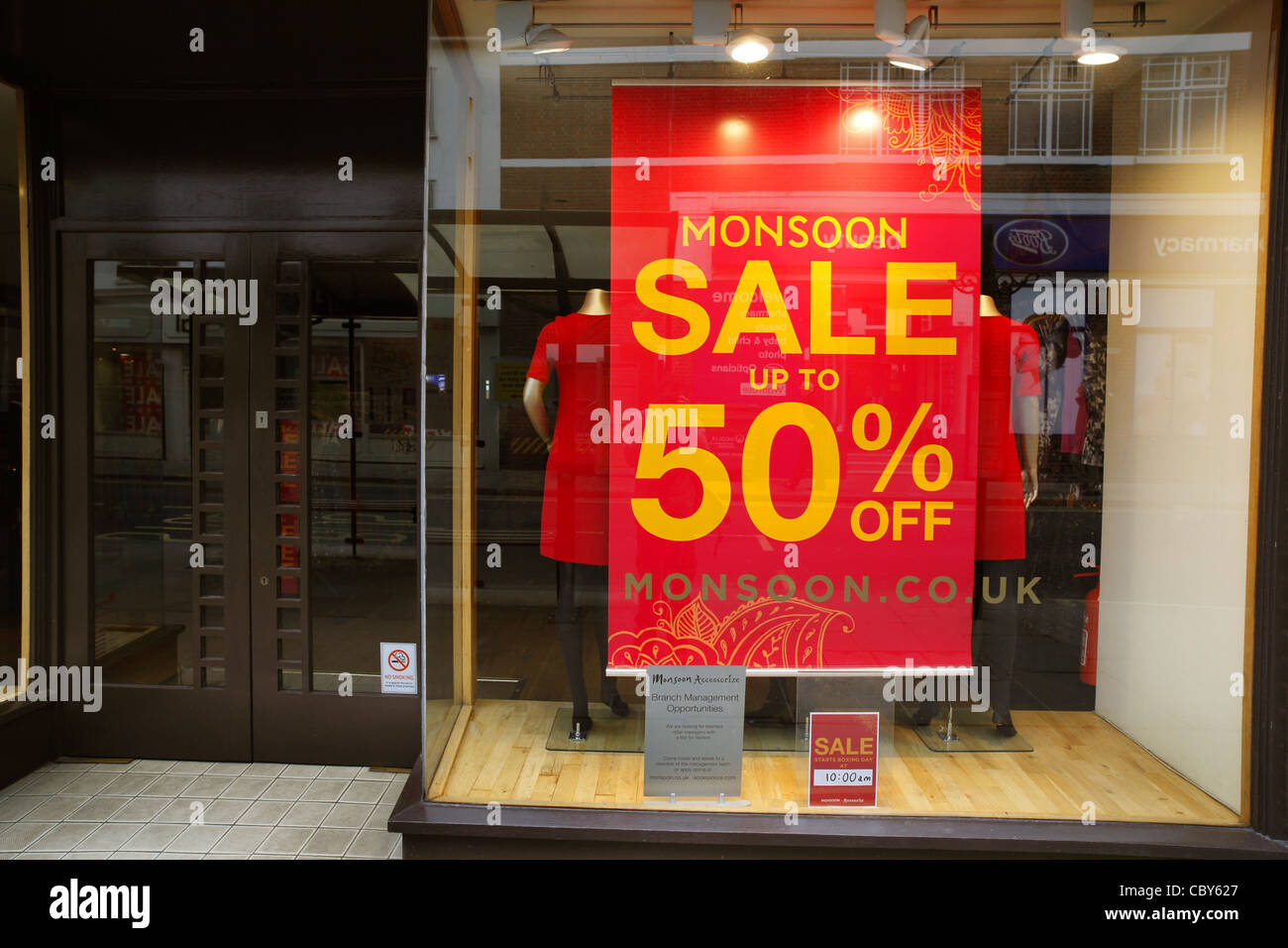 Boxing day sale posters in a Monsoon shop window Stock Photo - Alamy