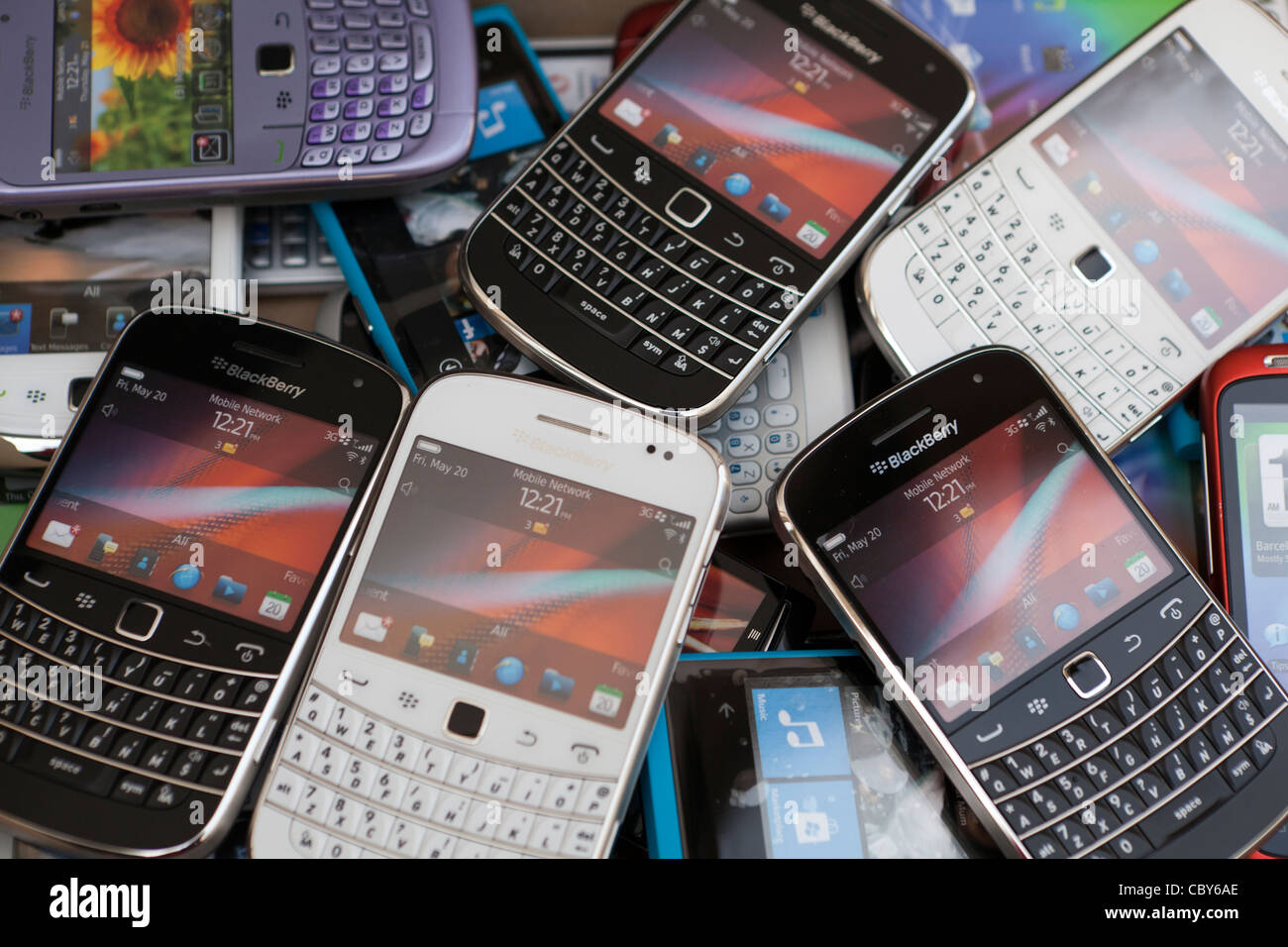 Pile smart phones hi-res stock photography and images - Alamy