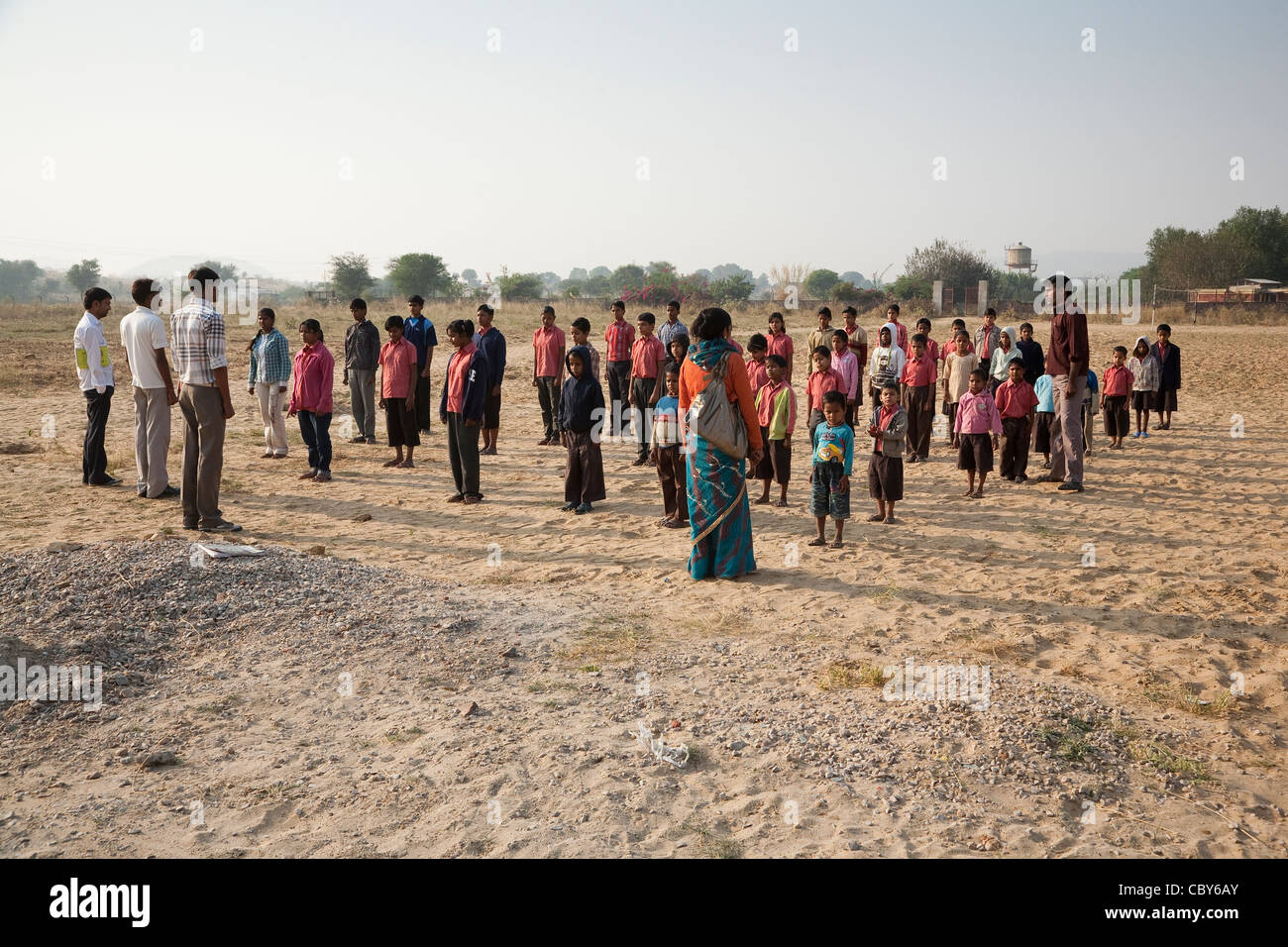 Students lined up for calisthenics before class at the Udayan School ...