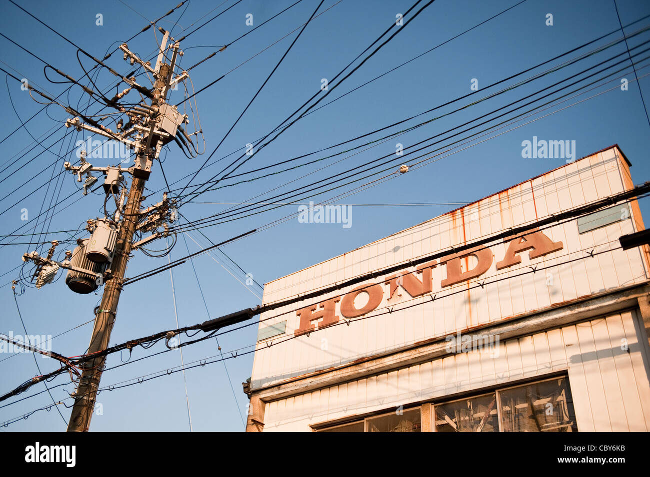 Old Honda garage building behind a electric pylon in Kyoto, Japan Stock ...
