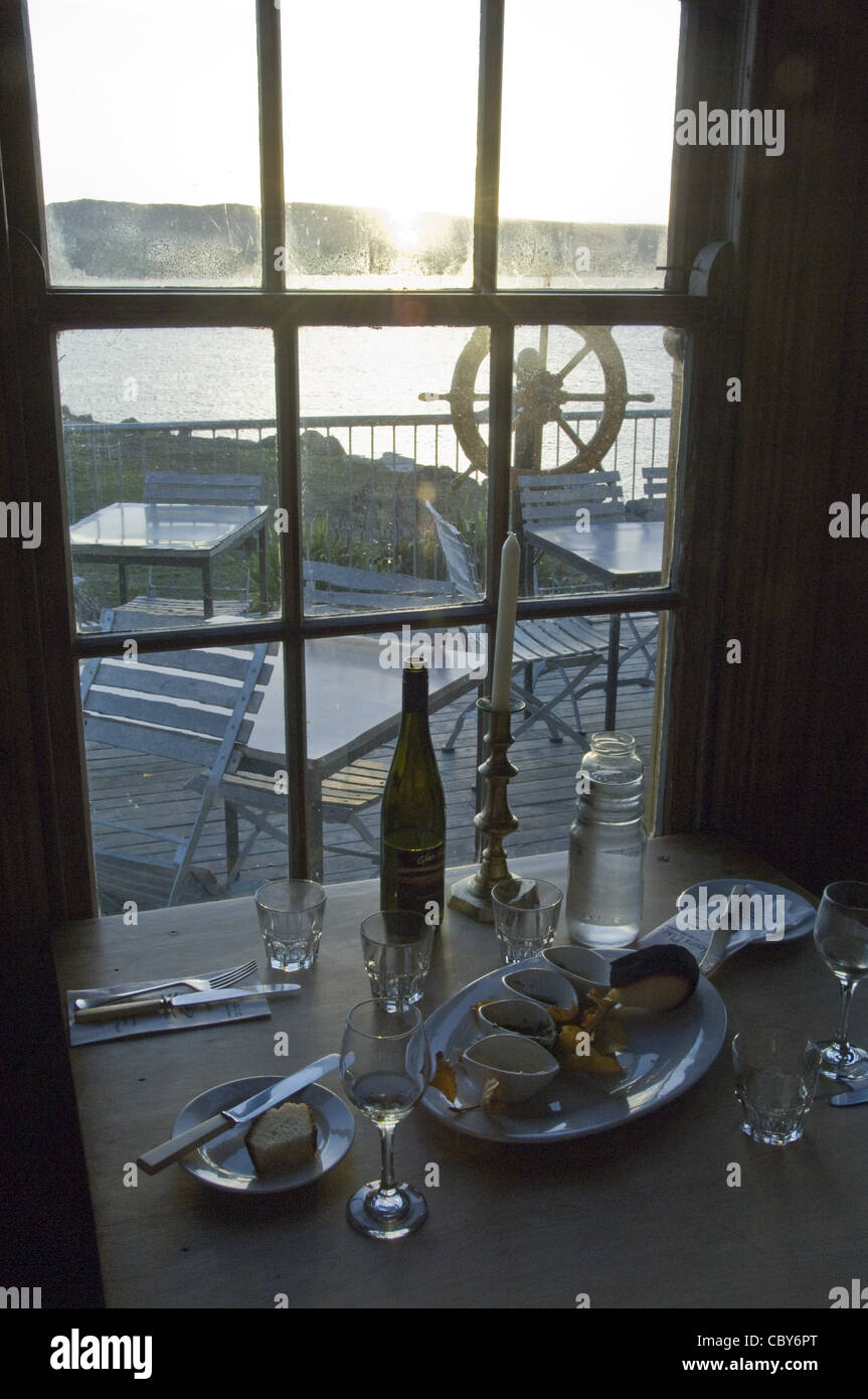 meal on rustic table in front of window Stock Photo - Alamy