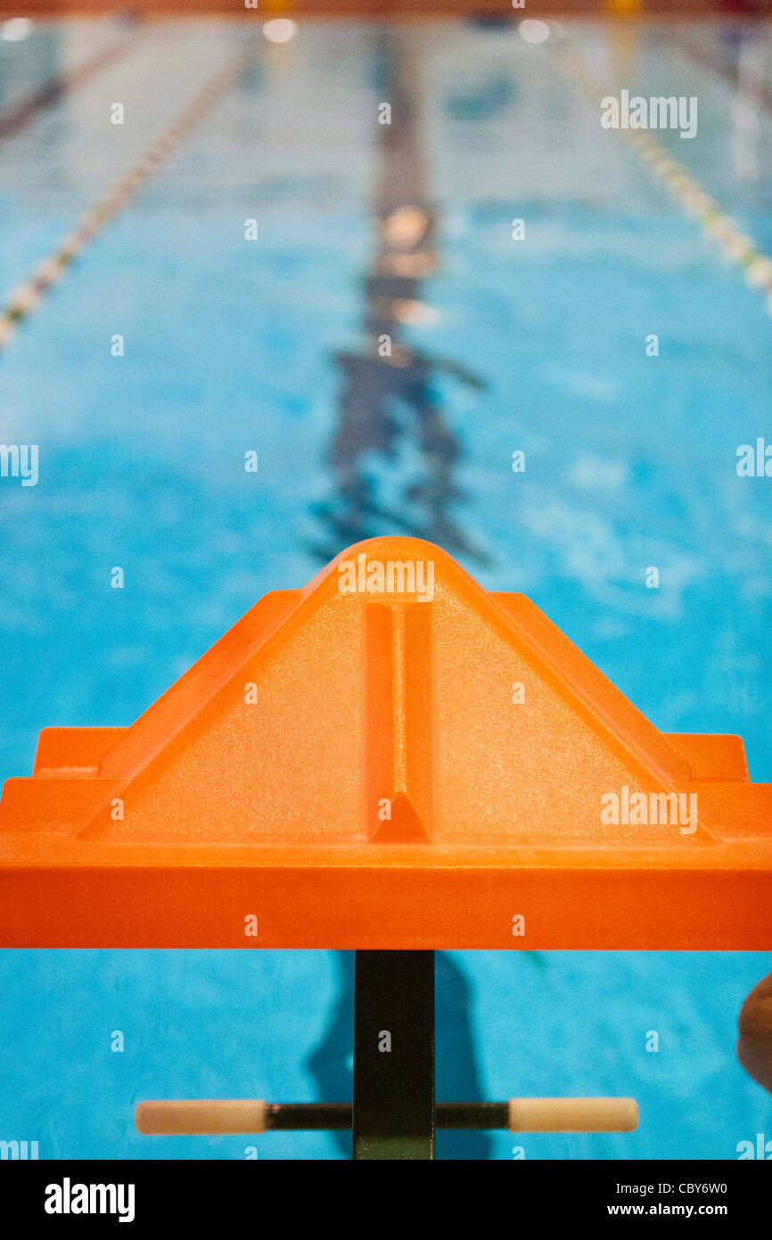 Orange swimmers starting platform Stock Photo - Alamy