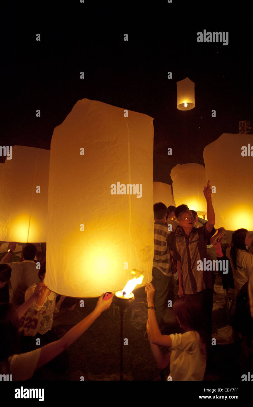 Traditional fire lanterns being released into the night sky during the ...