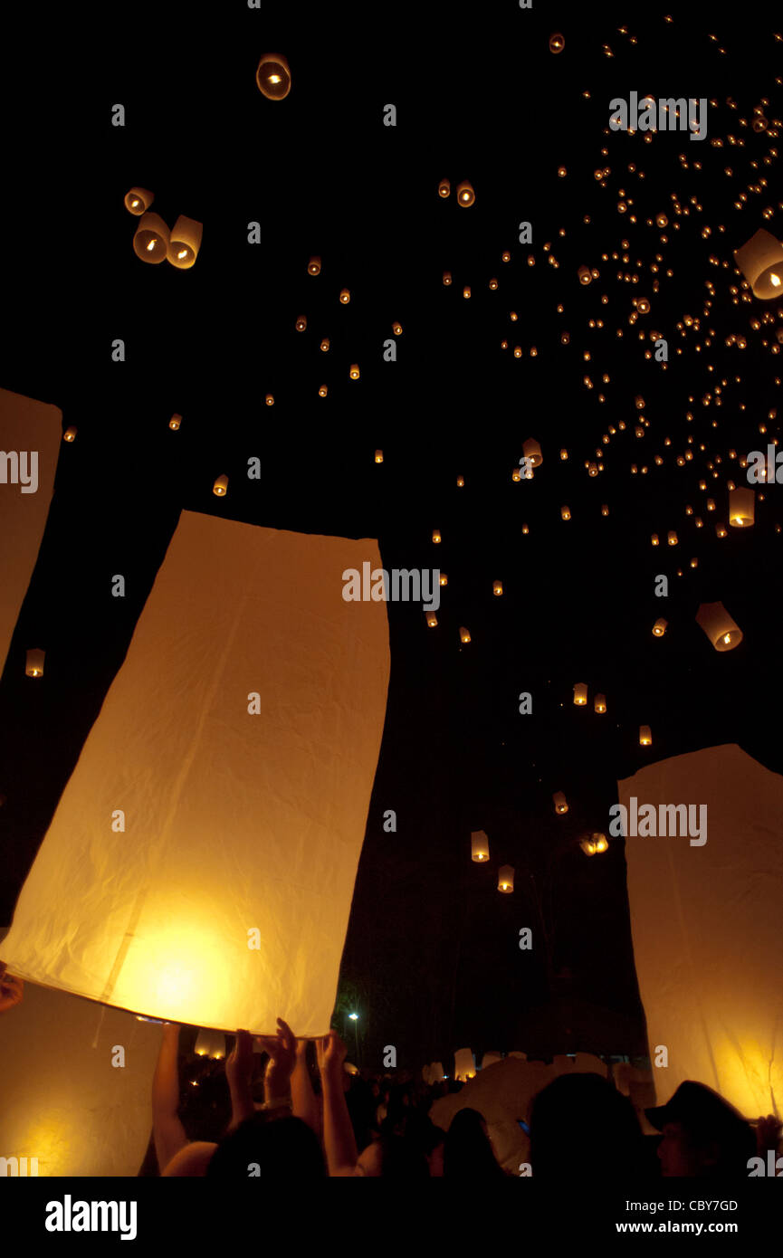 Traditional fire lanterns being released into the night sky during the ...