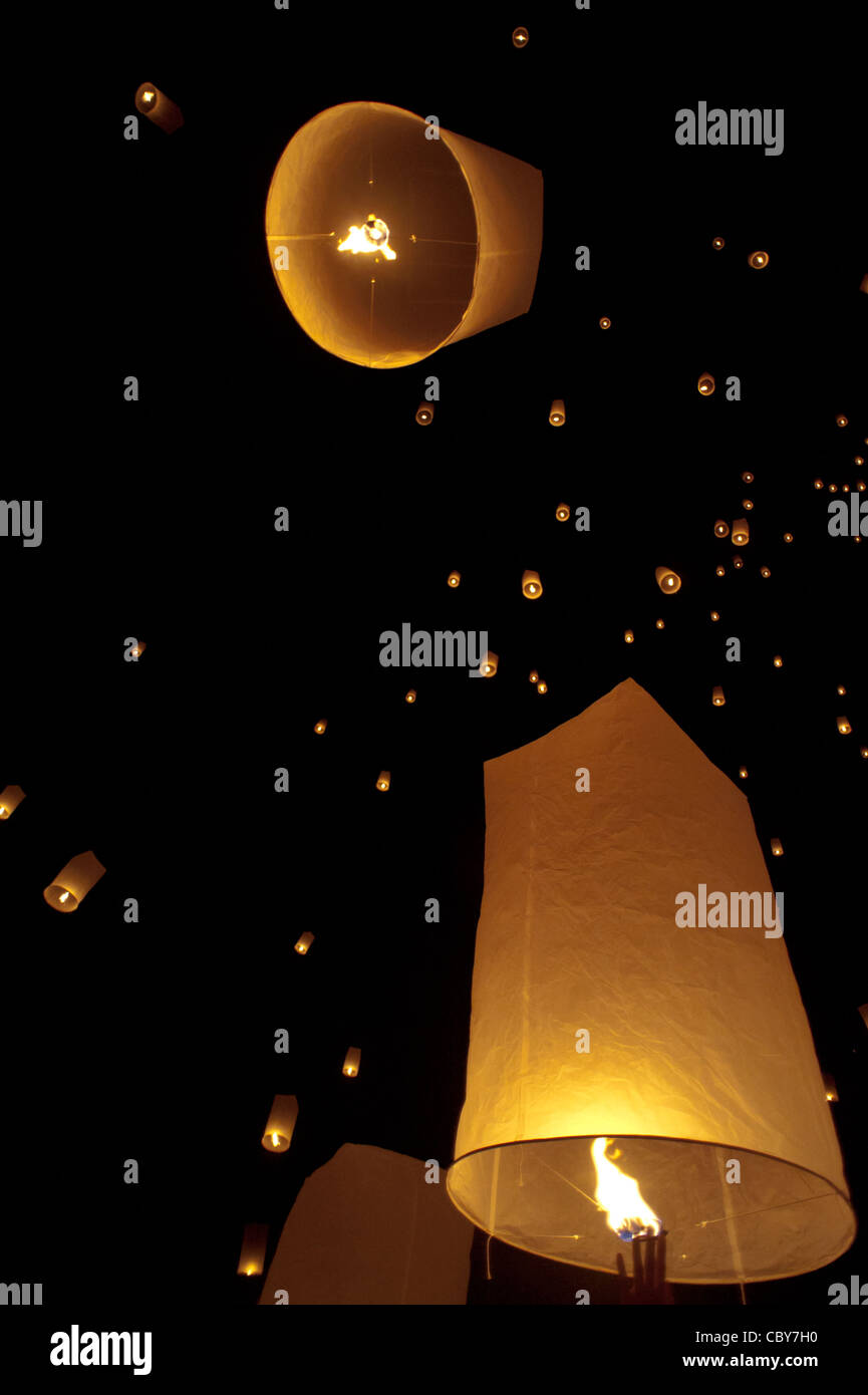 Traditional fire lanterns being released into the night sky during the ...