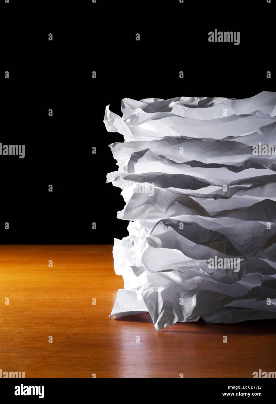 Stack of Crinkled Paper being recycled on Desk Stock Photo - Alamy
