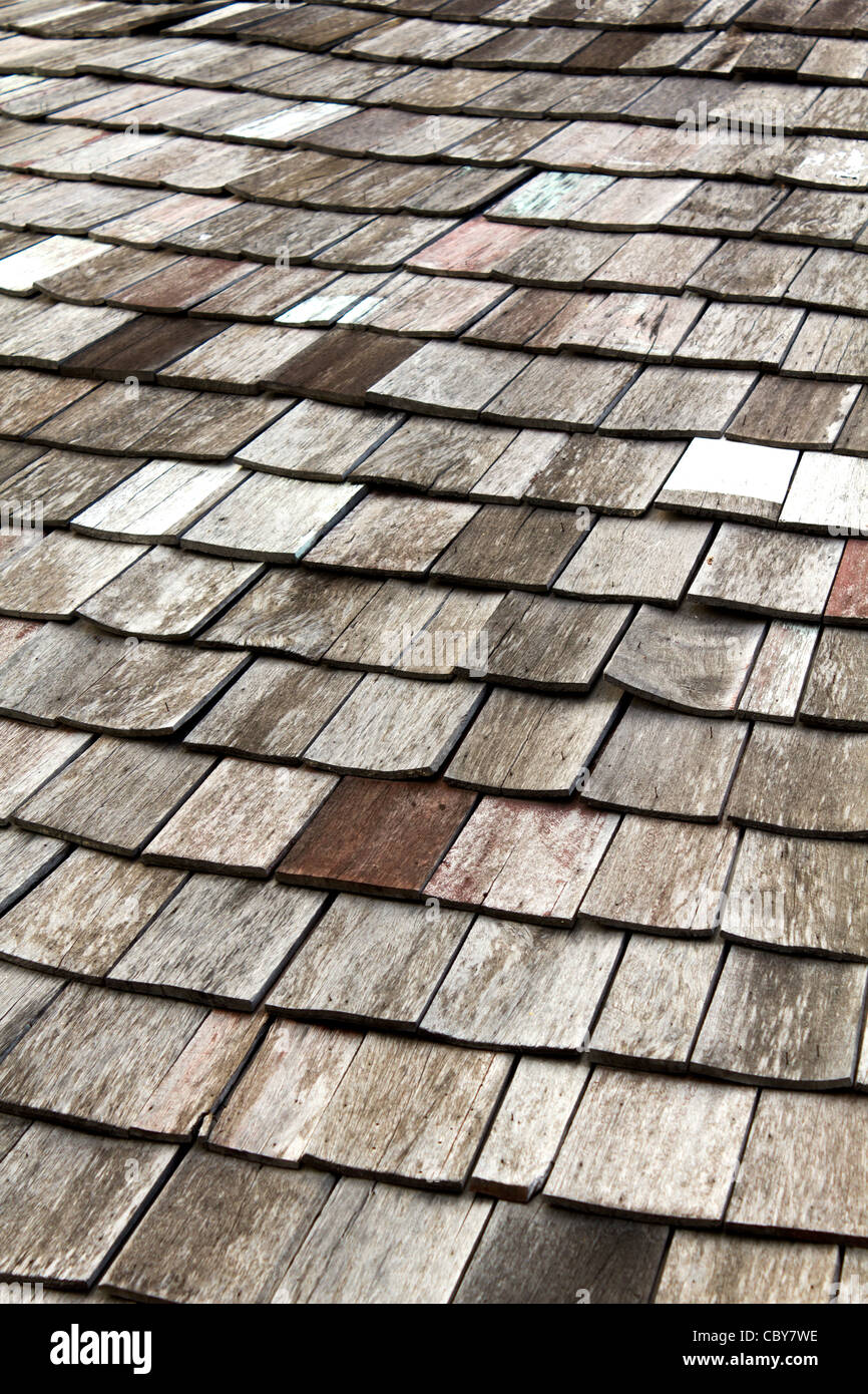 old worn shingle roof pattern in thailand Stock Photo - Alamy
