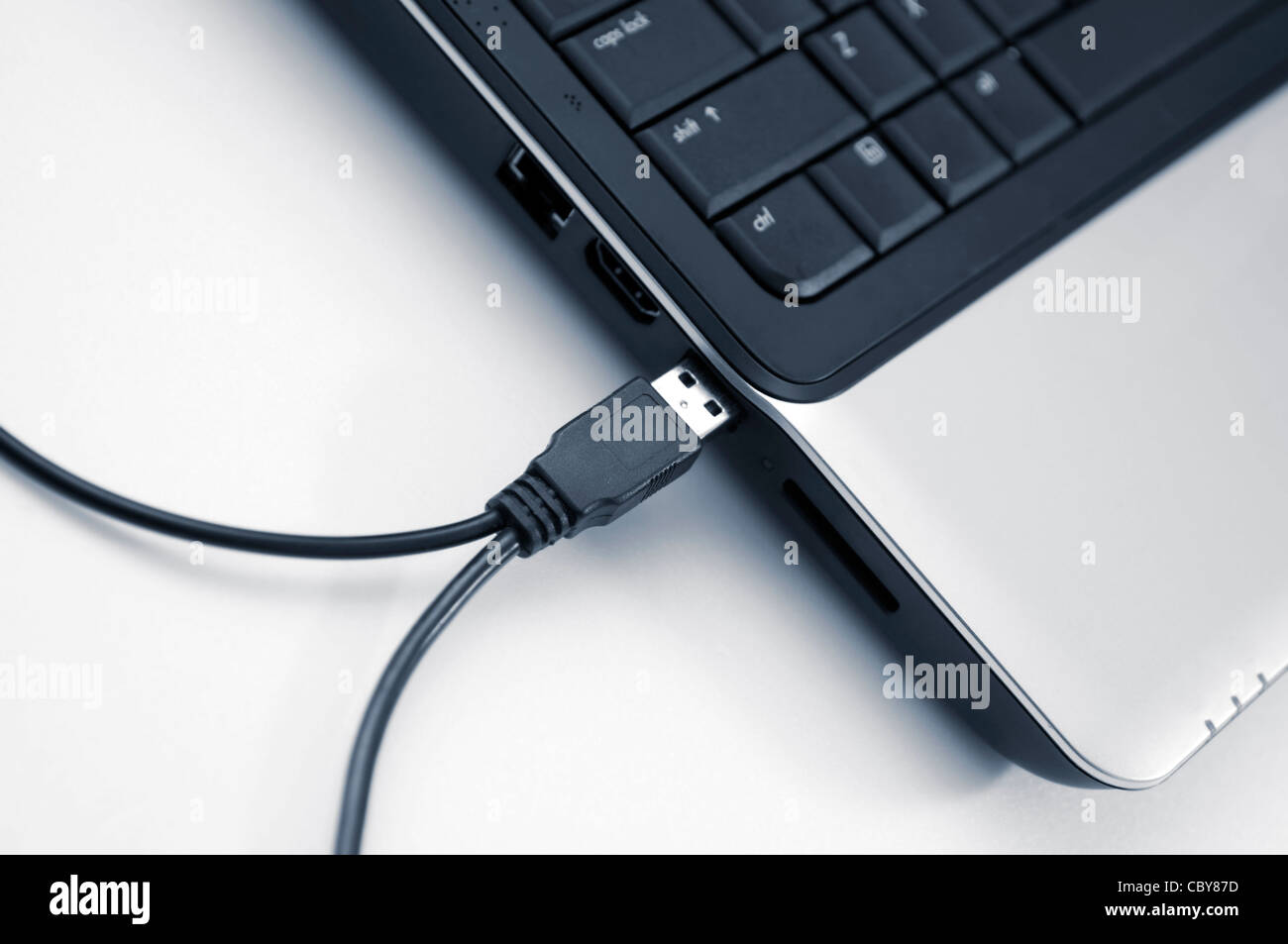 Connect usb cable to a laptop Stock Photo - Alamy
