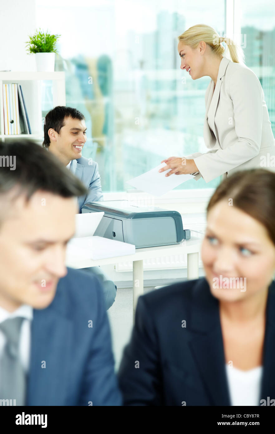 Secretary showing copy to boss in working environment in office Stock ...