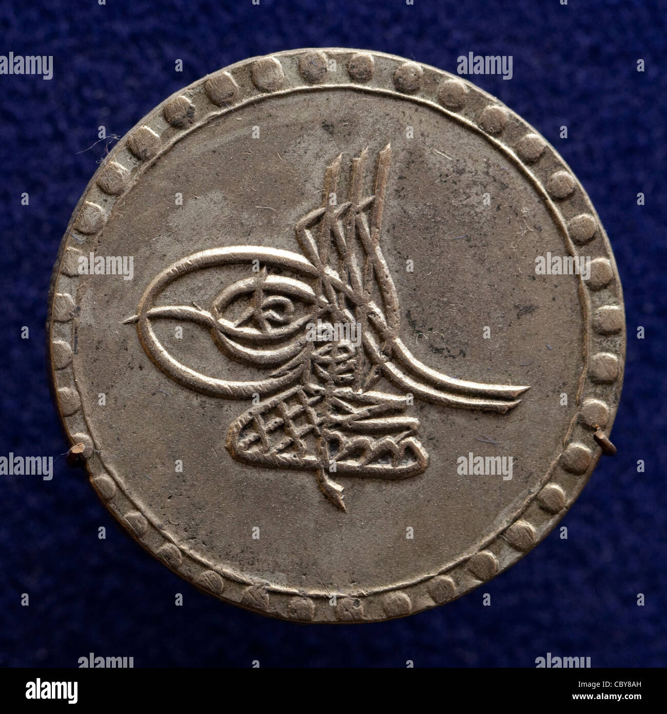 Old Ottoman coin bearing the Tughra seal of a sultan that was affixed ...