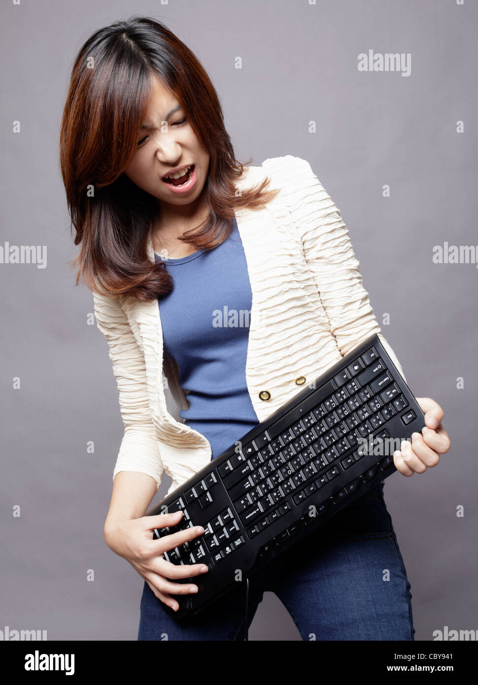 Office lady plays keyboard Stock Photo - Alamy