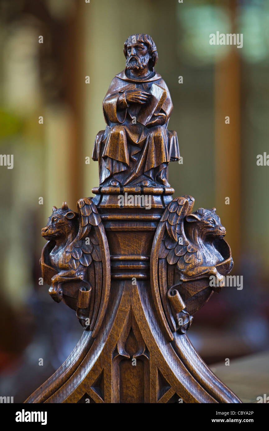 A wooden carving on the end of a pew in the chancel. Holy Trinity ...