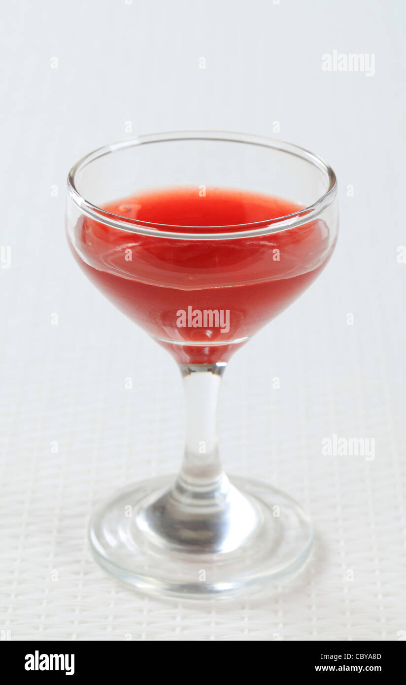 Red juice in a wine glass Stock Photo - Alamy