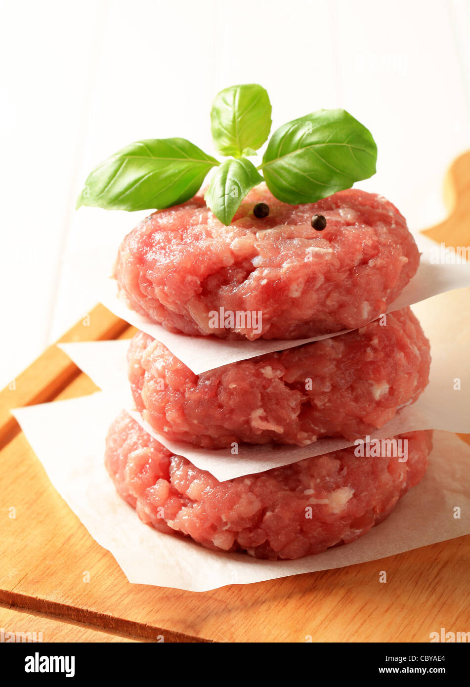 Pile raw meat patties on hi-res stock photography and images - Alamy