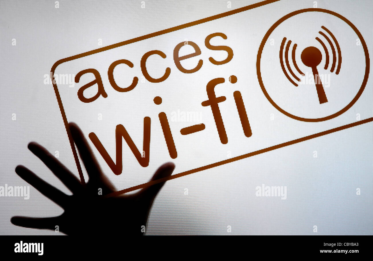 A hand pressed against a diffused screen with a WiFi sign Stock Photo ...