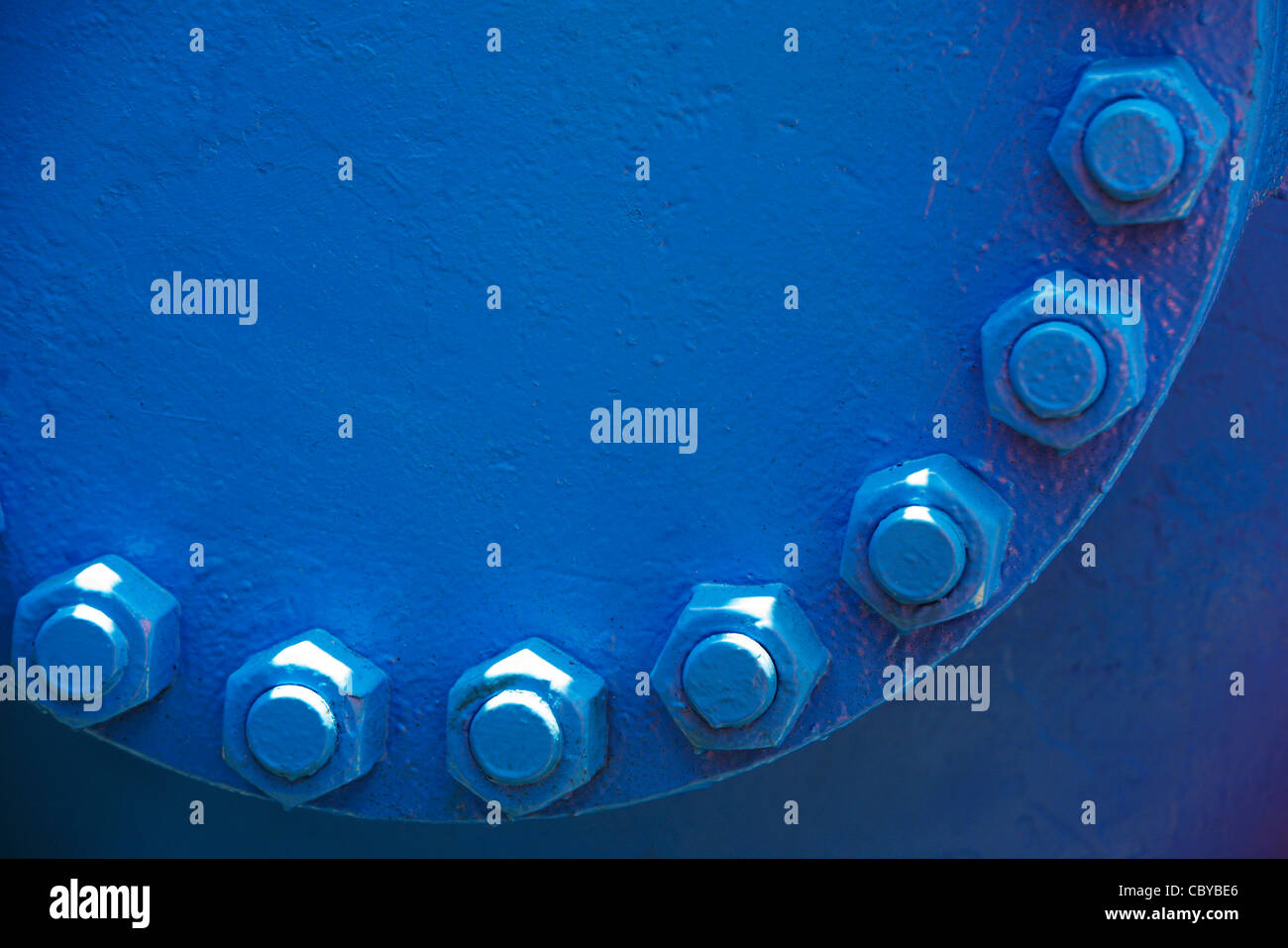 Detail of a blue pipe with screws Stock Photo - Alamy