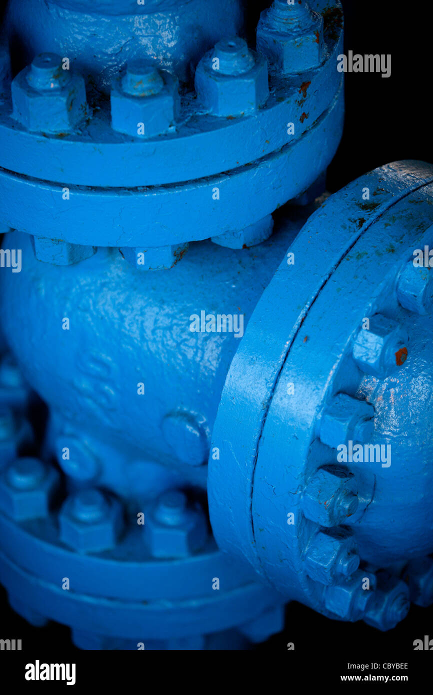 Detail of a blue pipe with screws Stock Photo - Alamy