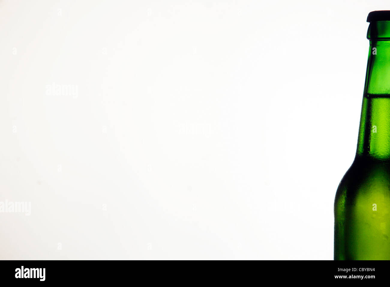 Detail of a beer bottle against a white background Stock Photo - Alamy