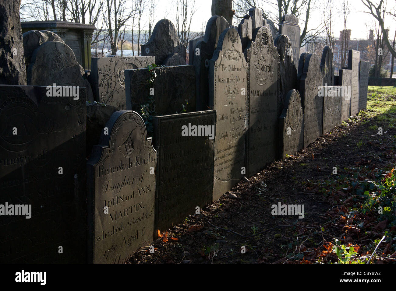 Gravestones in sunlight Stock Photo - Alamy