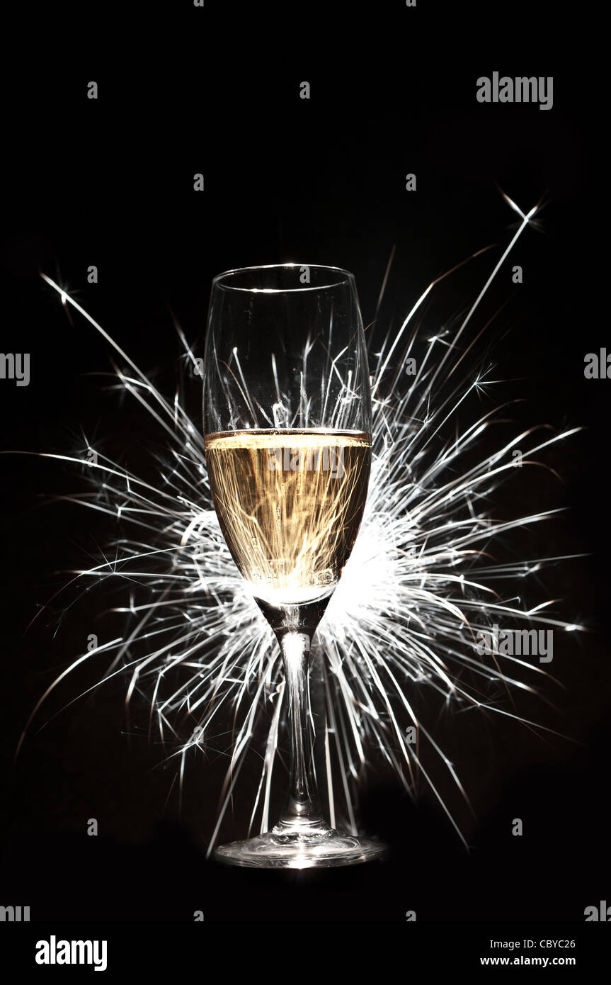 glass of champagne with fire works Stock Photo - Alamy