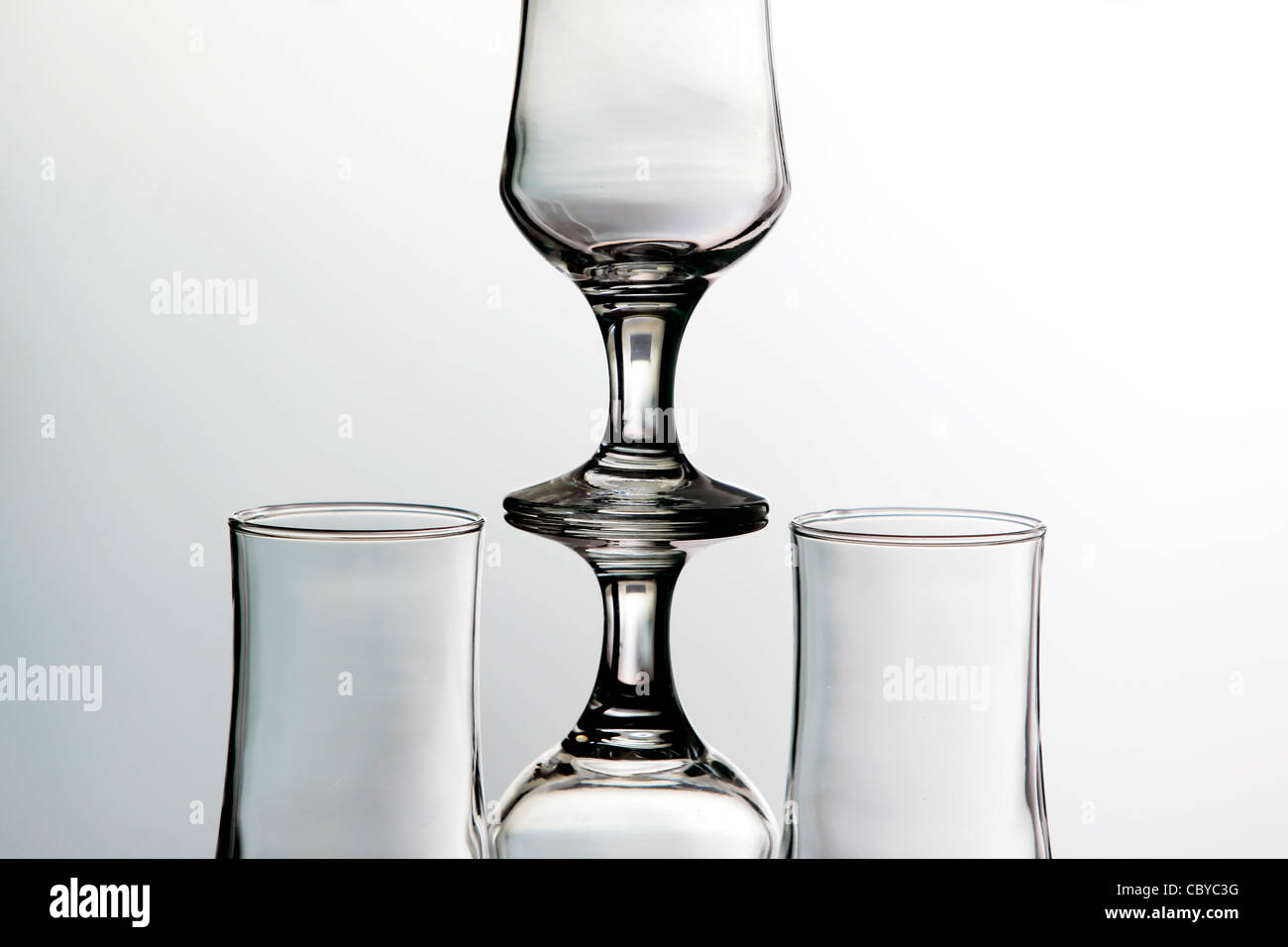 Empty glasses arrangement on a white background Stock Photo - Alamy