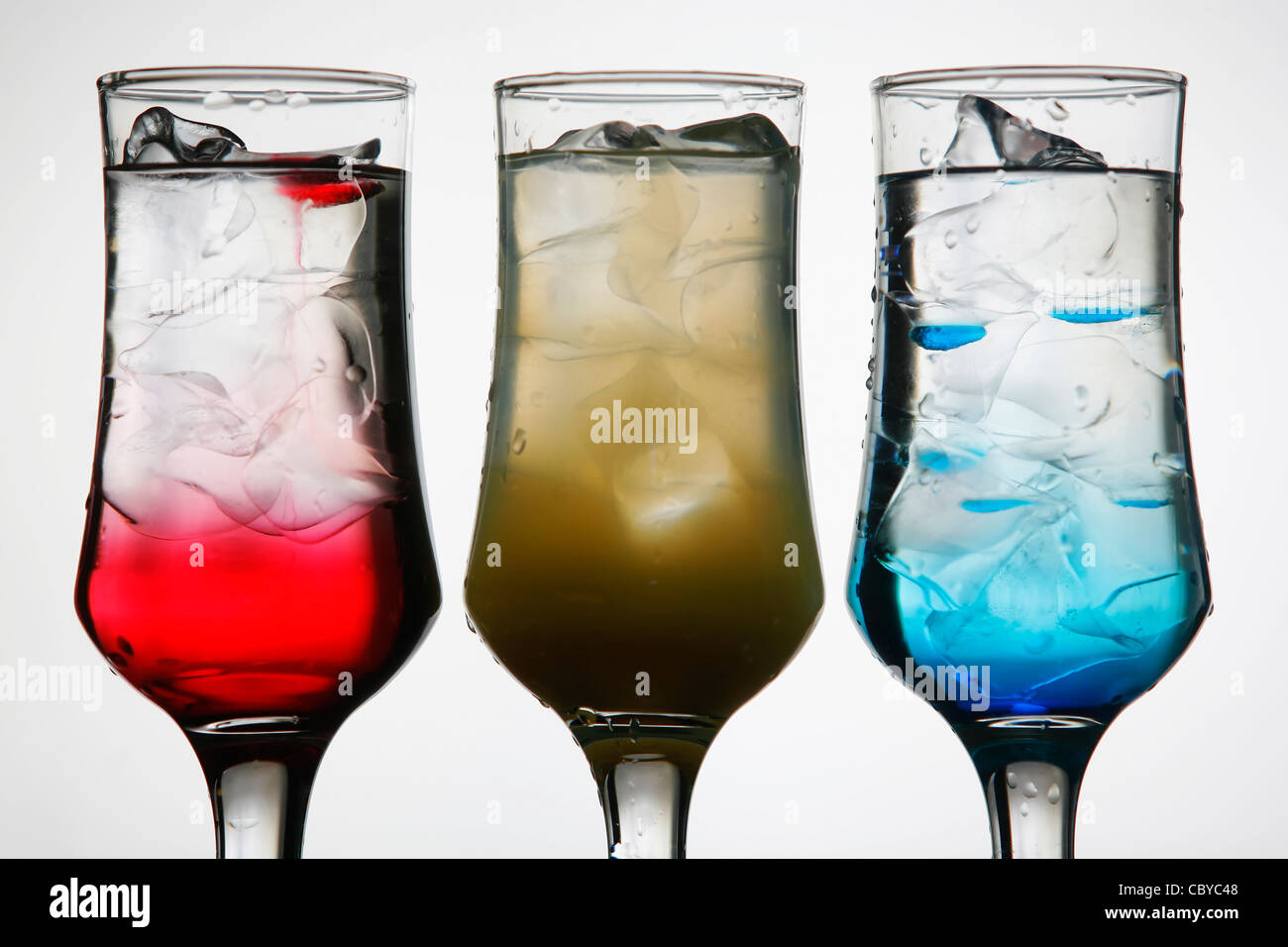 Three colored cocktails in a row Stock Photo - Alamy