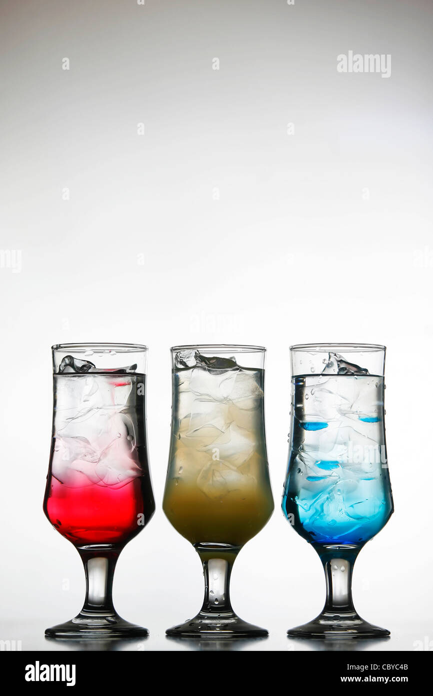 Three colored cocktails in a row Stock Photo - Alamy