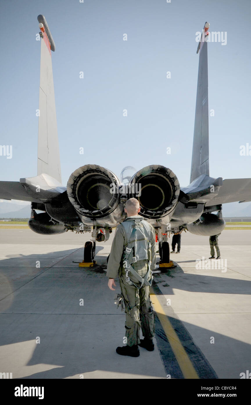 Capt. David Gunter inspects the exhaust of an F-15E Strike Eagle during ...