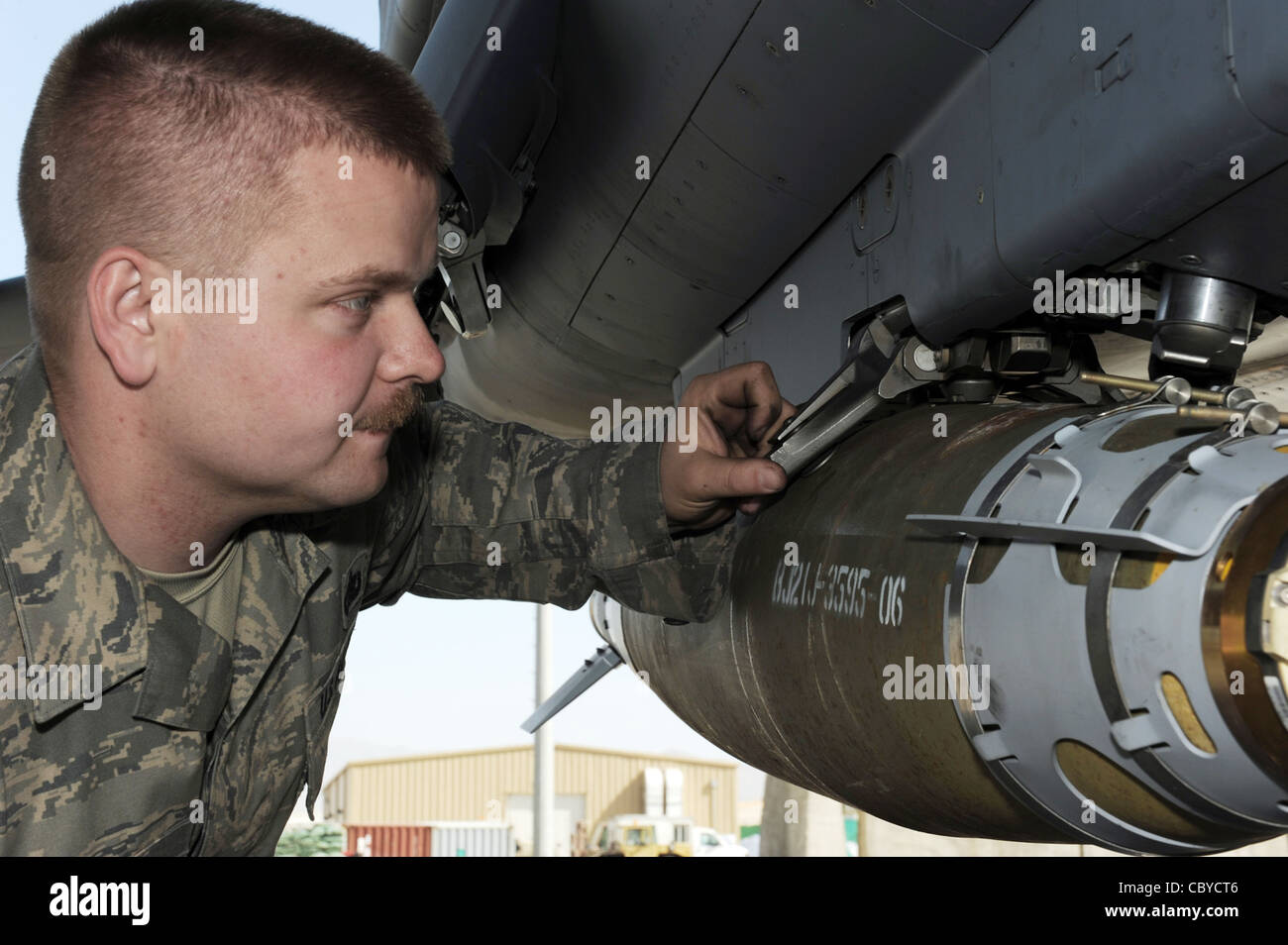 Staff Sgt. Justin Wilson inspects the bomb rack of an F-15E Strike ...