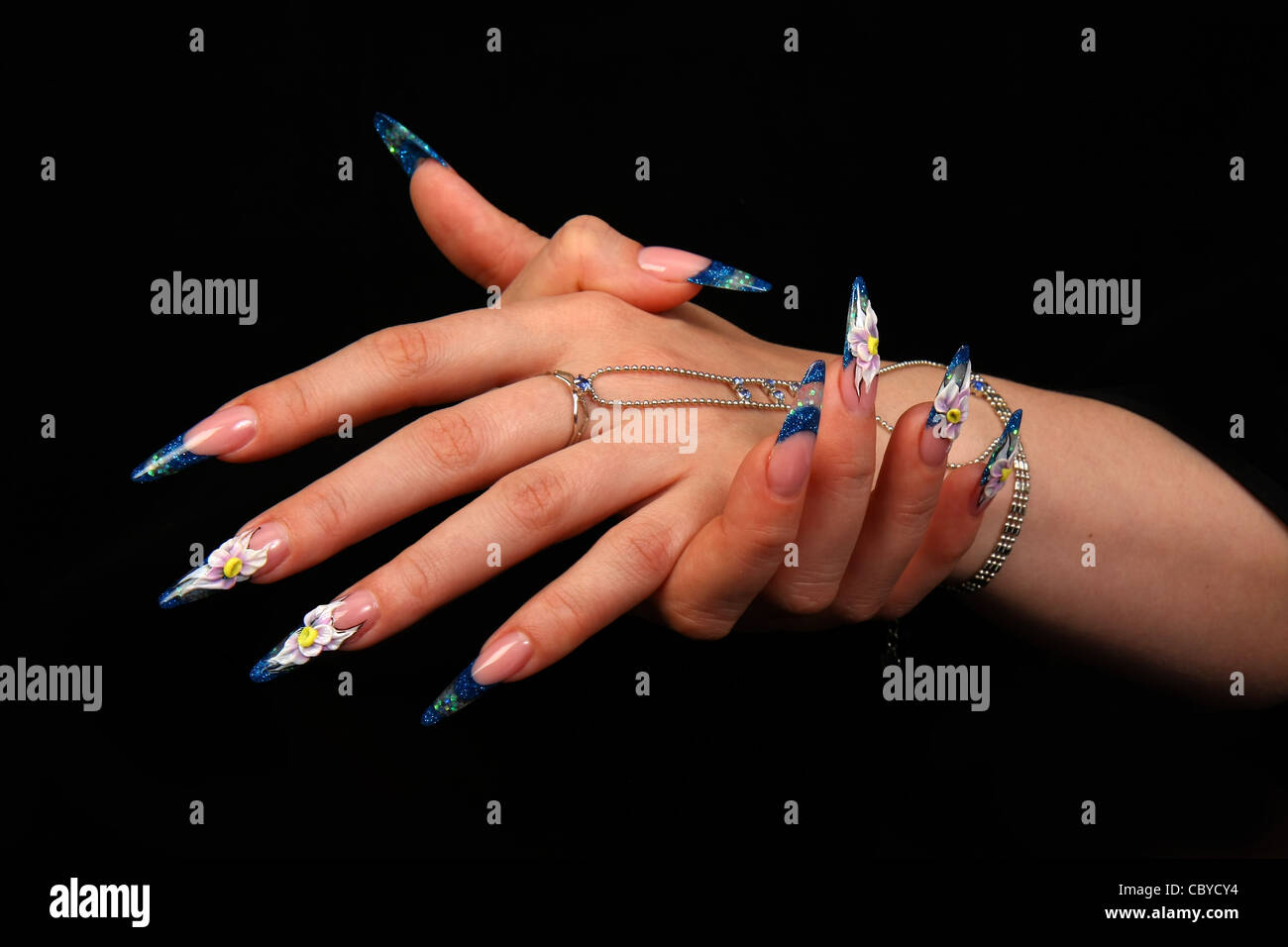 Pretty woman hand with perfect painted nails isolated on black ...