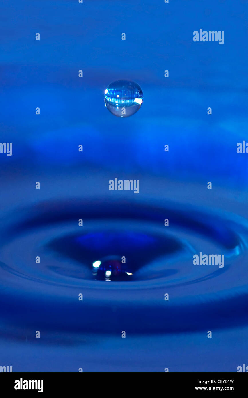 Reflection in a drop of water with blue coloring Stock Photo - Alamy