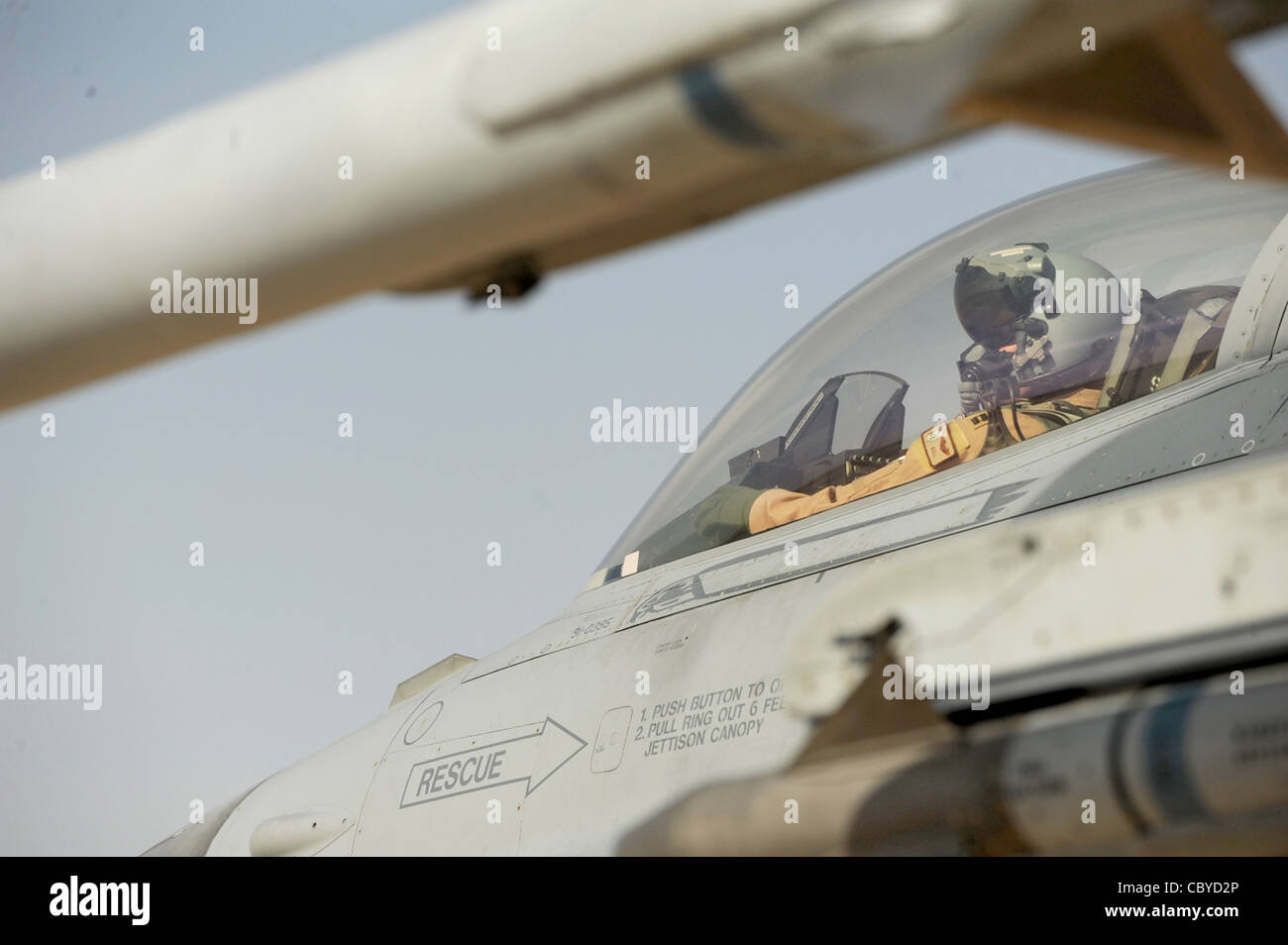Capt. Bailyn Beck prepares an F-16 Fighting Falcon for takeoff Oct. 18 ...