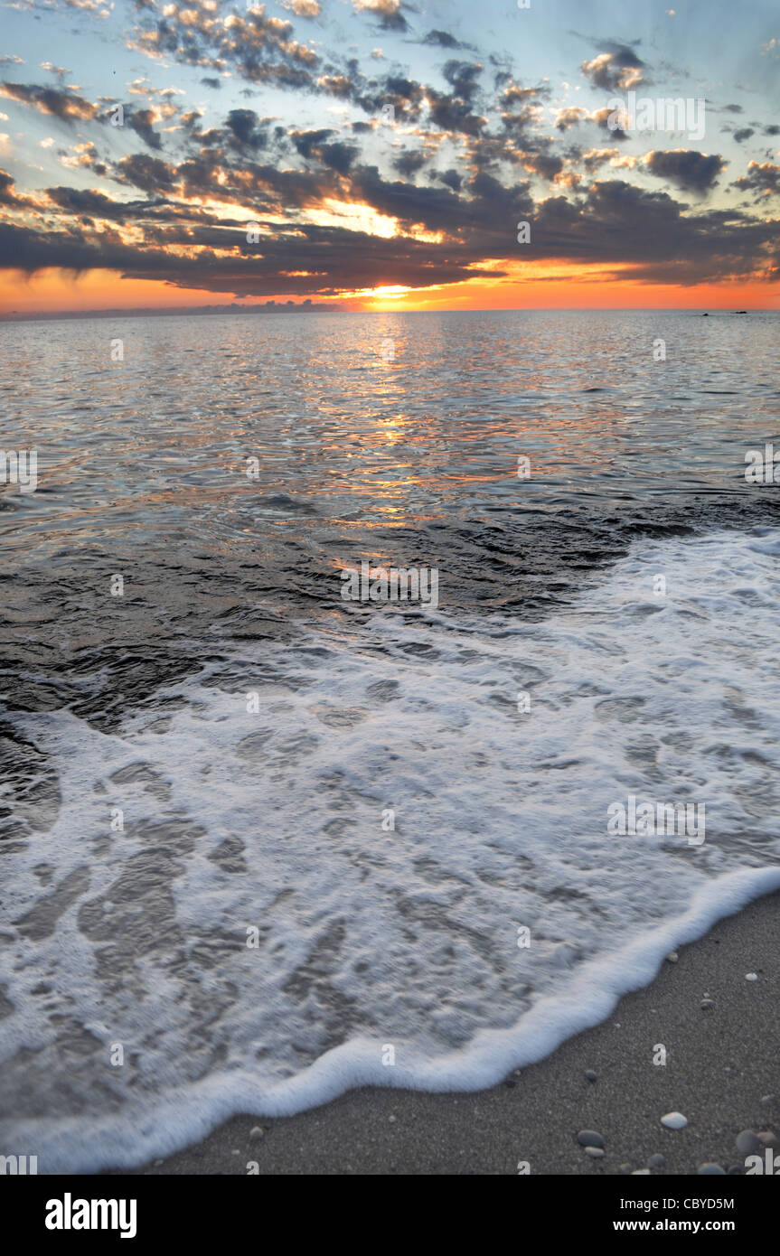 Sundown on the water of the mediterranean sea Stock Photo - Alamy