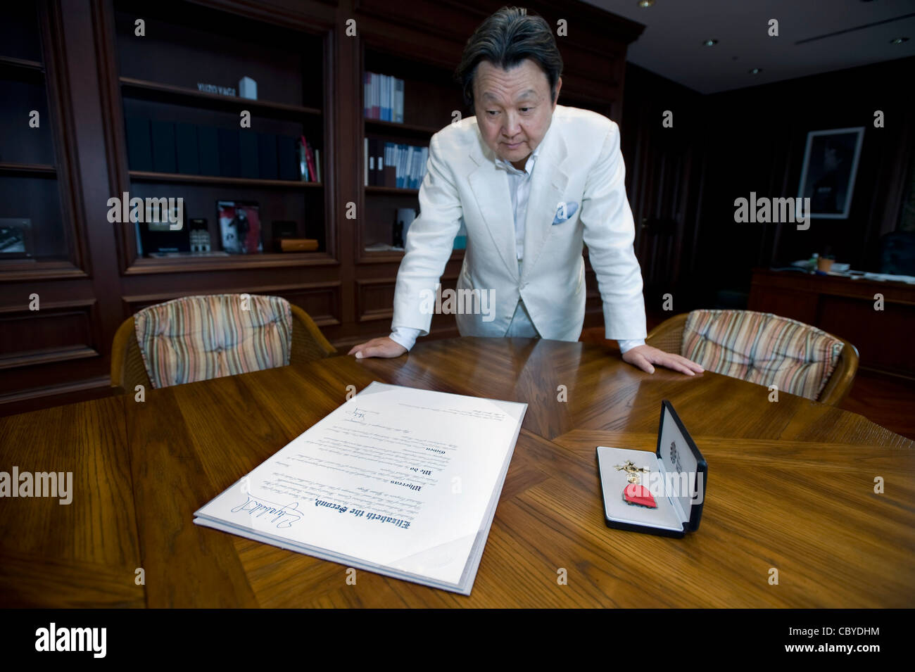 Yuzo Yagi, president and CEO of Yagi Tsusho Ltd., displays his medal ...