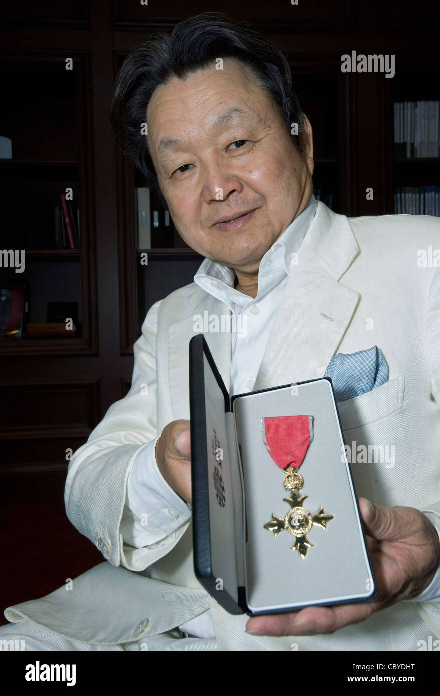 Yuzo Yagi, president and CEO of Yagi Tsusho Ltd., displays his medal ...