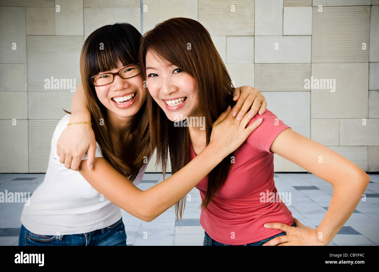 Two young Asian university students in campus Stock Photo - Alamy