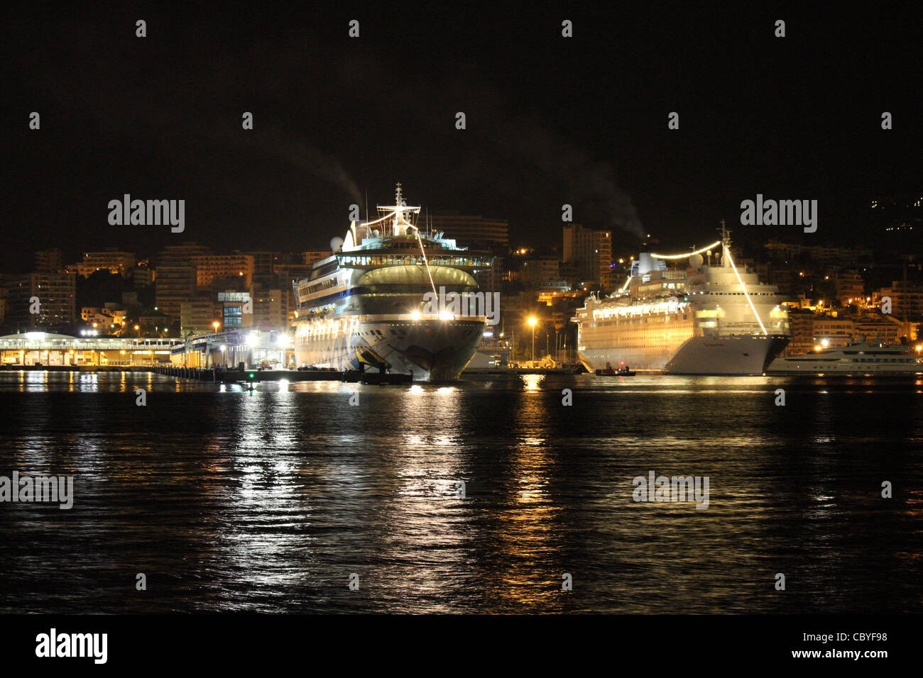 Pre dawn Cruise Liner "Thomson Dream" on RHS going astern onto berth ...