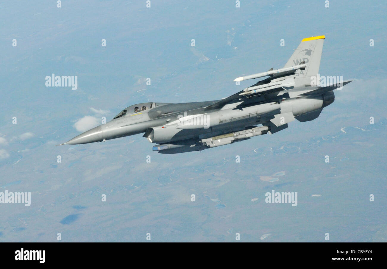 An F-16 Fighting Falcon pilot moves into position as he waits for the ...