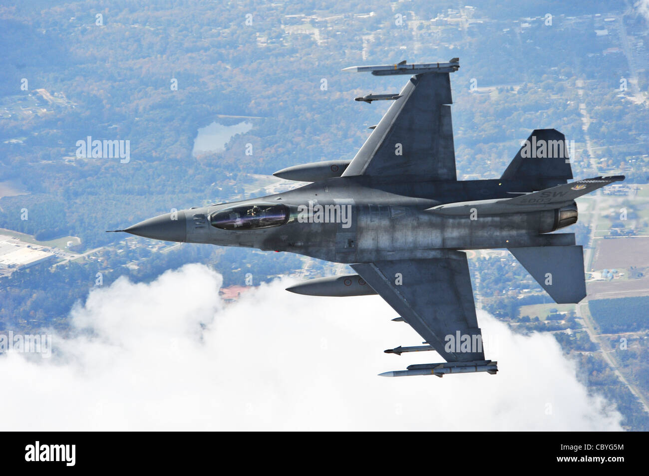 Capt. Matthew Feeman in an F-16 Fighting Falcon approaches a Cessna ...