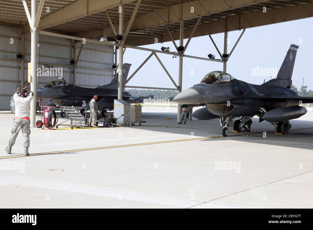 Alert F-16 Fighting Falcons are readied to roll during an alert mission ...