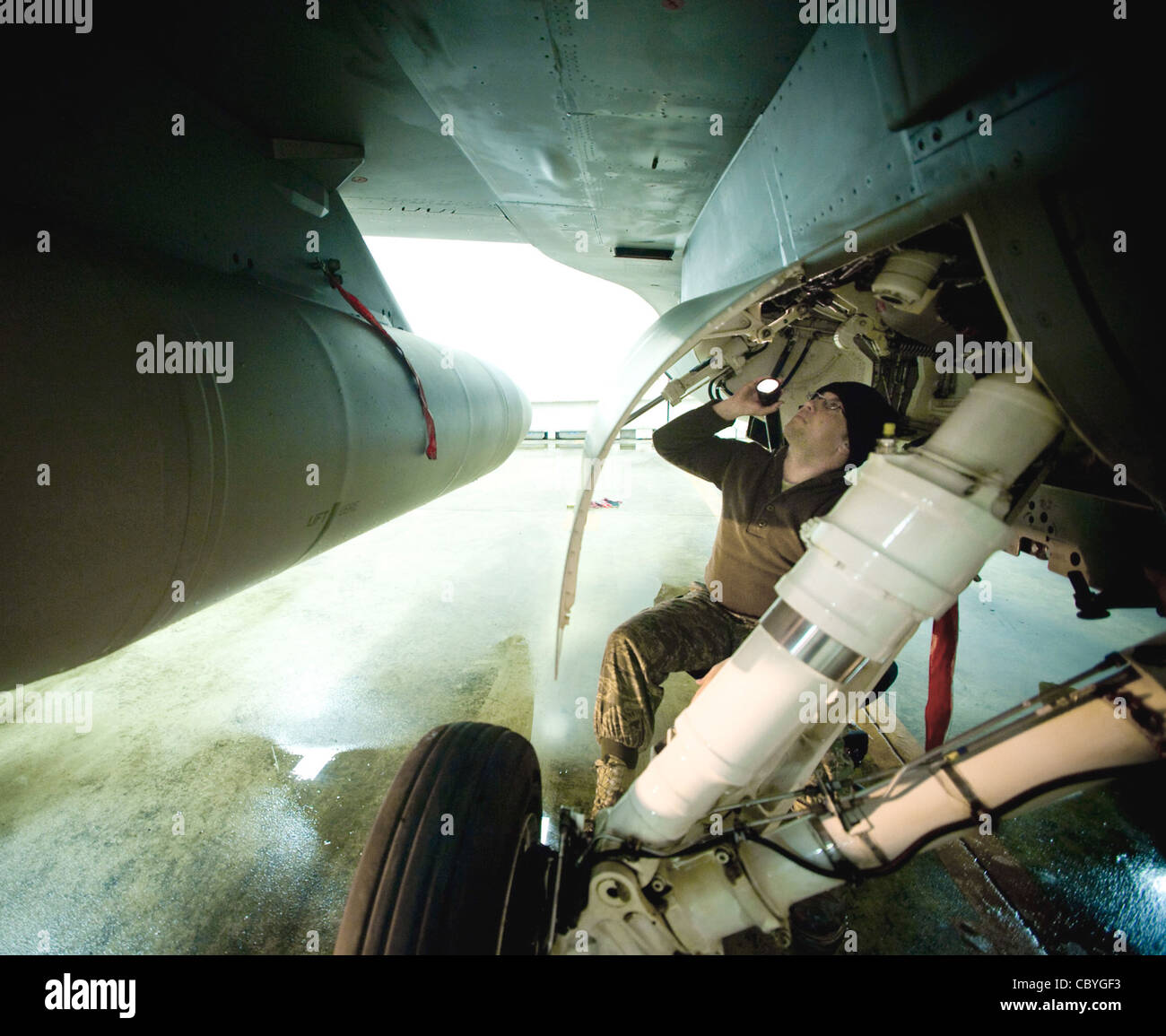 Staff Sgt. Brad Millhouse performs a quality assurance inspection on ...