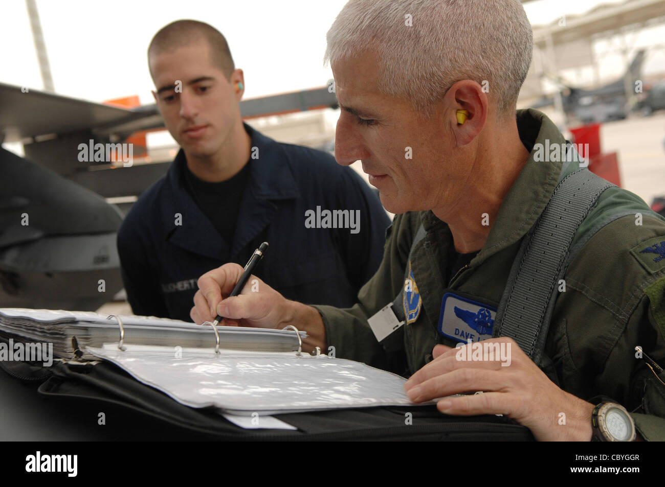 Col. David Lujan, 56th Operations Group deputy commander, fills out his ...