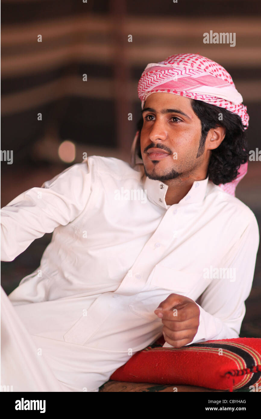 Young Bedouin, nomad arab, in his home tent, in the desert of Wadi Rum ...