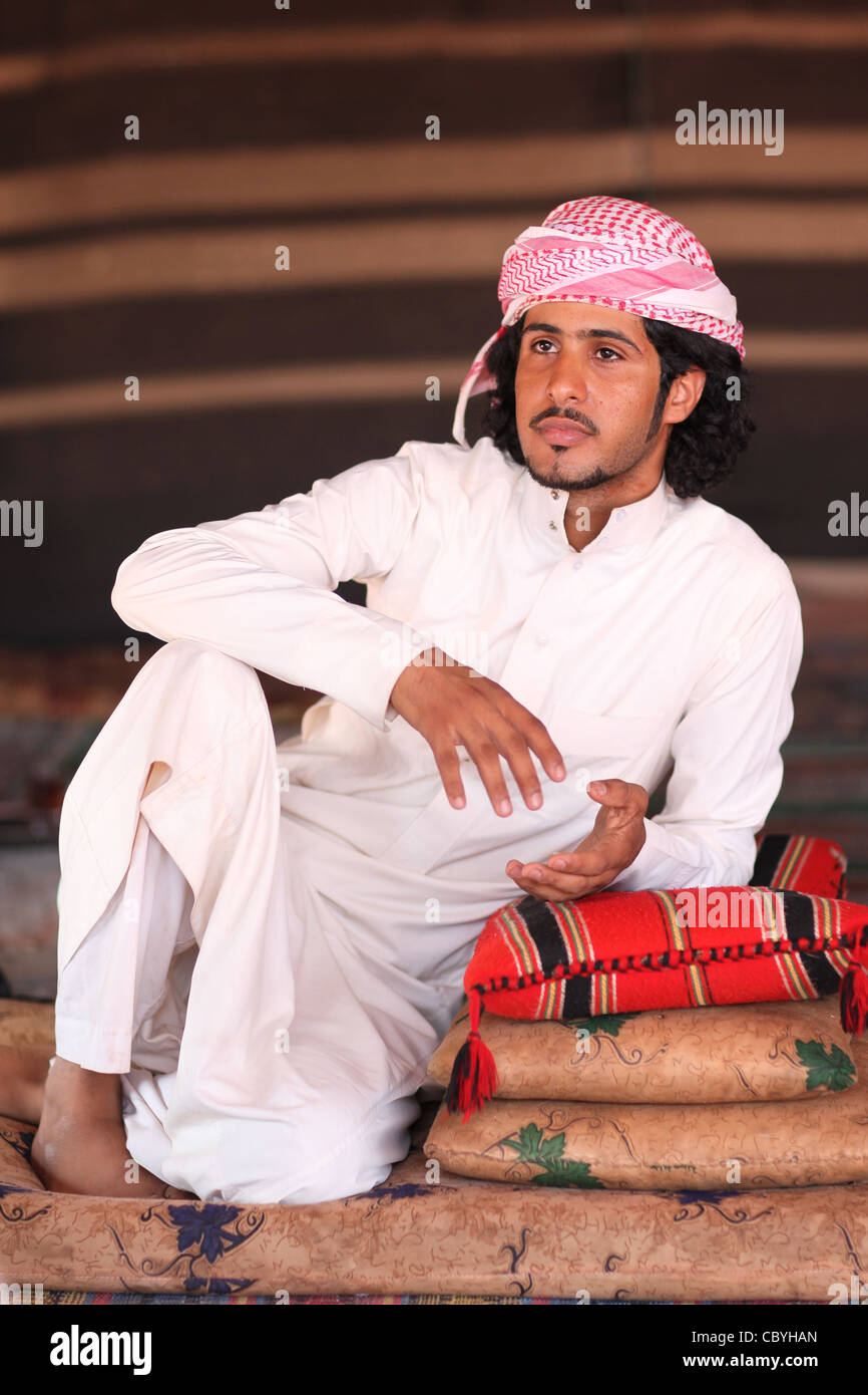 Young Bedouin, nomad arab, in his home tent, in the desert of Wadi Rum ...