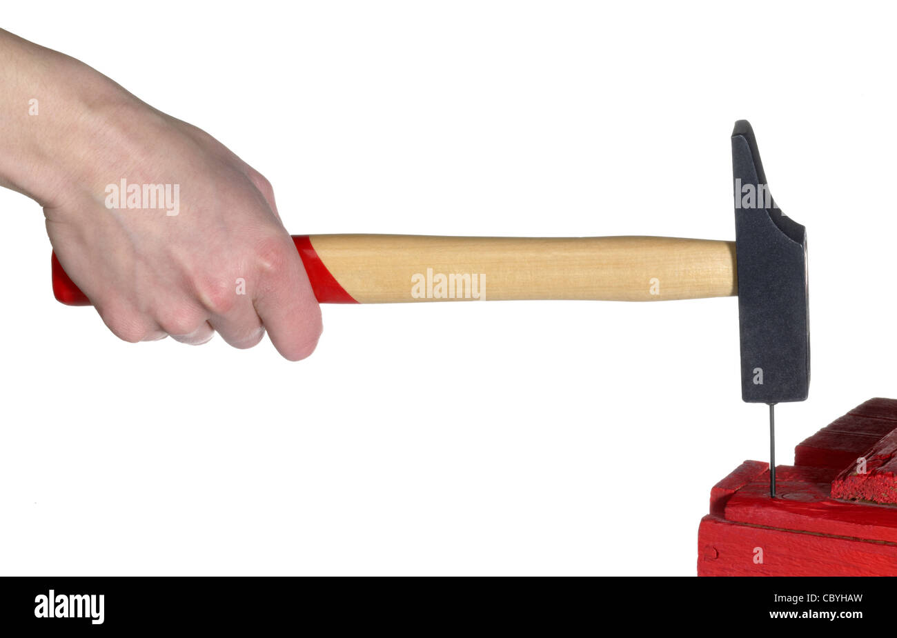 a hammering hand in white back Stock Photo - Alamy