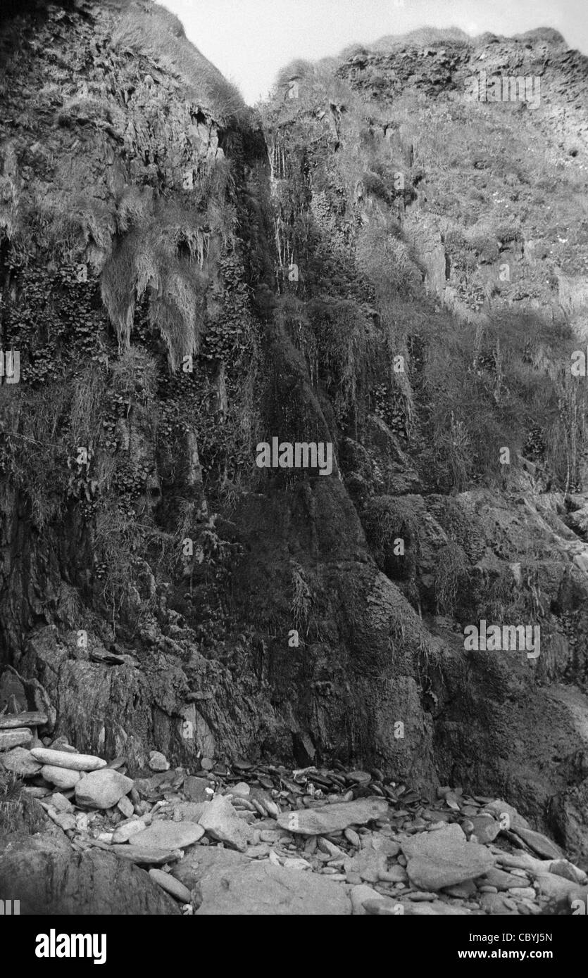 Waterfall cascading from cliffs, Dingle Bay Stock Photo - Alamy