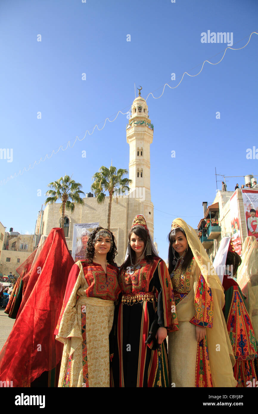 Christmas in Bethlehem, Palestinian girls in traditional dresses in ...