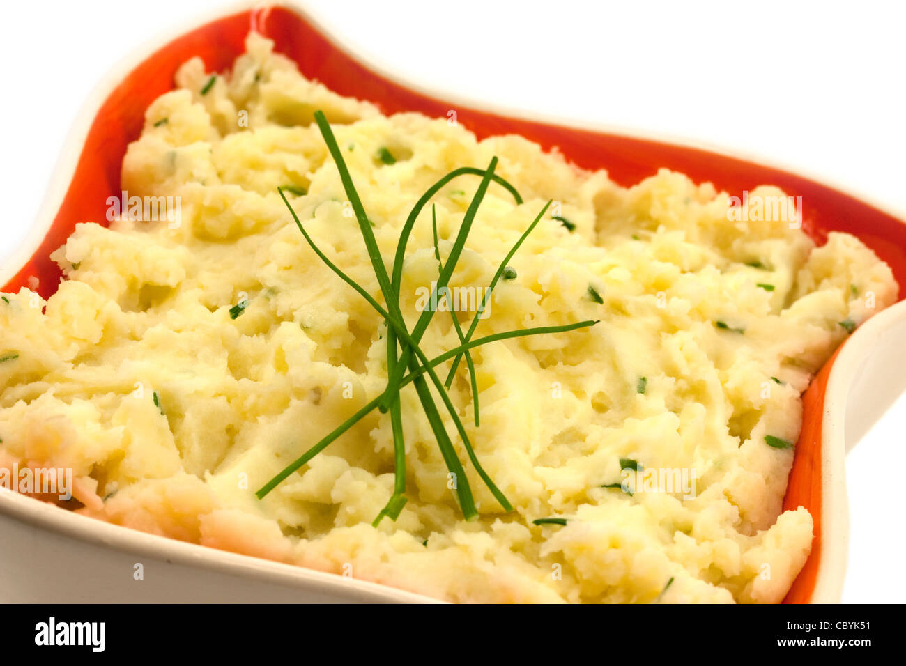 Potato mash with chives in a orange retro bowl Stock Photo - Alamy