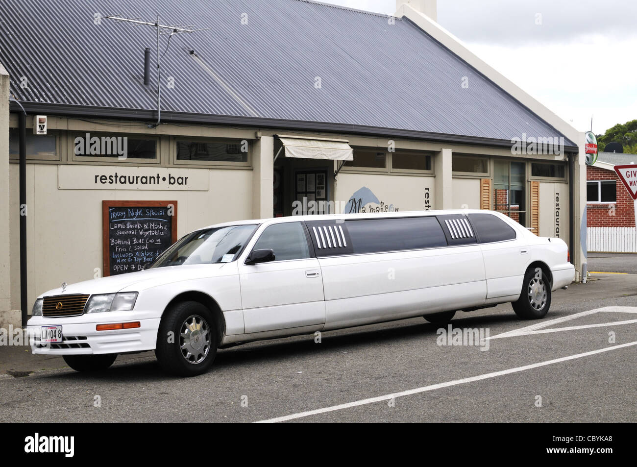 Stretch limo parked outside an Akaroa restaurant, New Zealand Stock ...